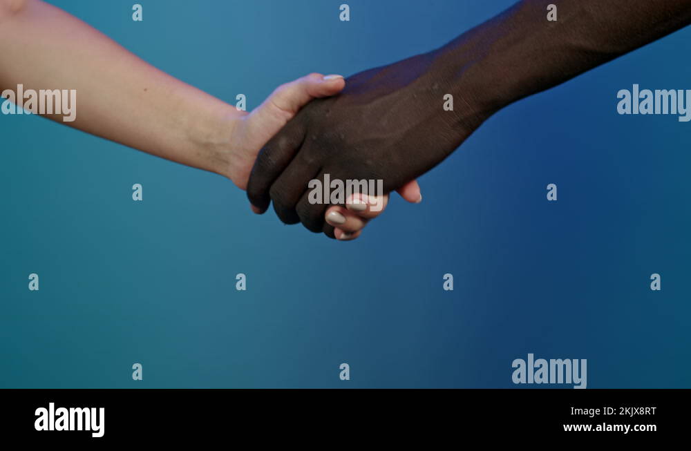 Hands of black man and white woman. Handshake close-up. Interracial ...
