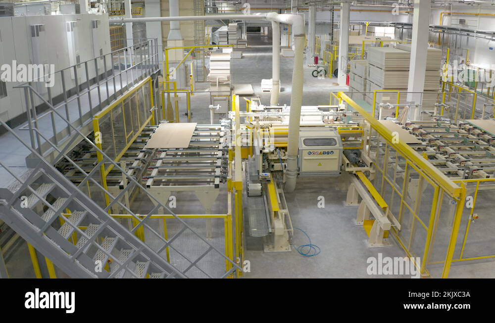 Manufacturing drywall or gypsum board by conveyor on factory ...