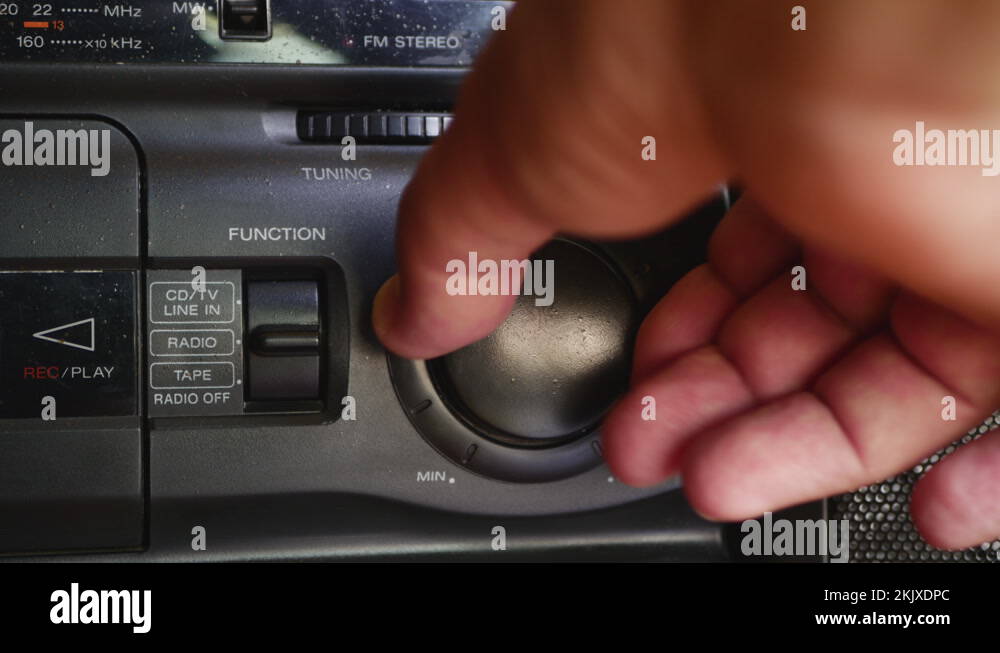 A Man's Hand Adjusts The Volume Control On An Old Tape Recorder Stock ...