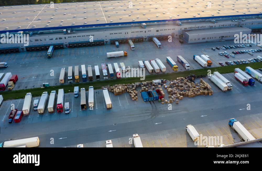 Logistics park with a warehouse - loading hub. Semi-trucks with freight ...