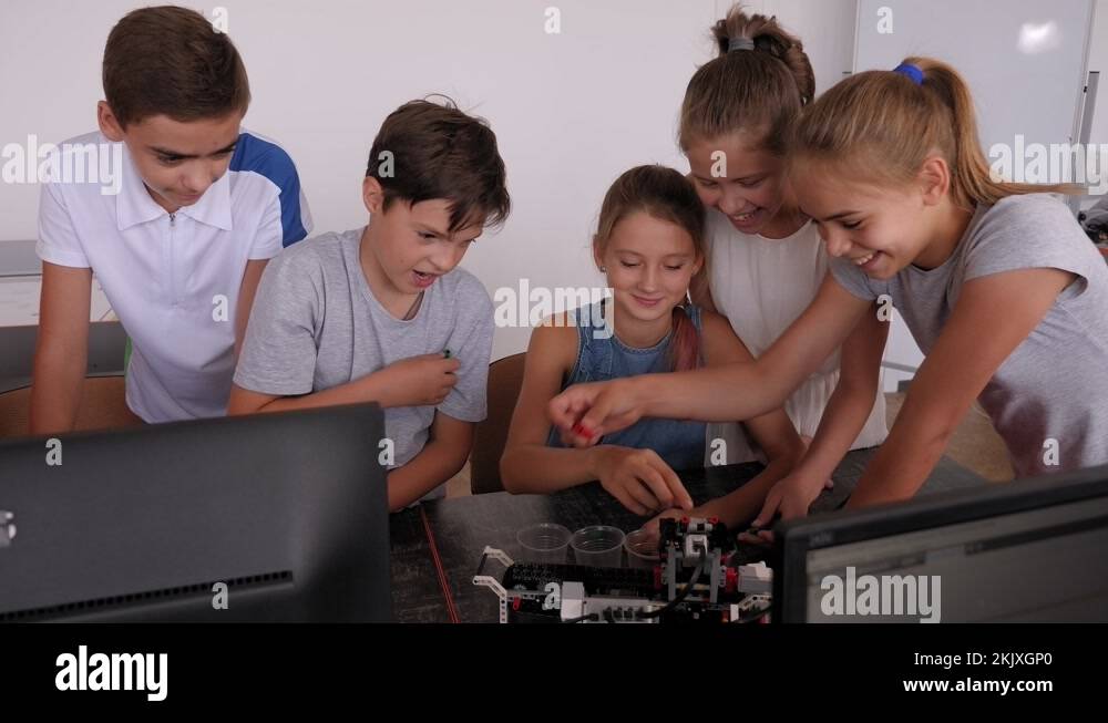 School children in robotics school makes robot managed from the ...