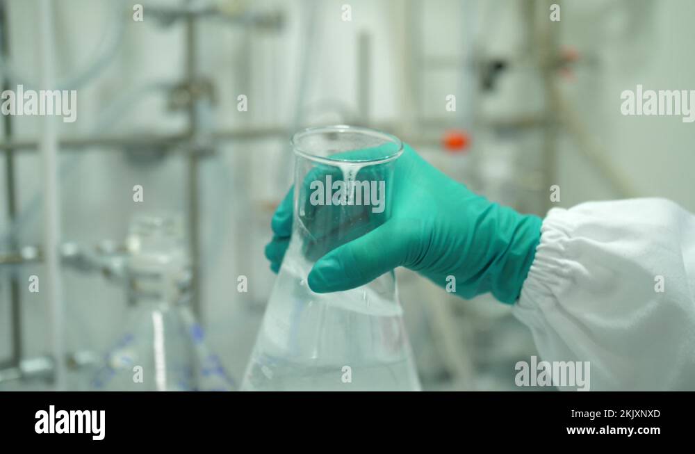 scientist hand shaking Erlenmeyer flask in laboratory 4k Stock Video ...