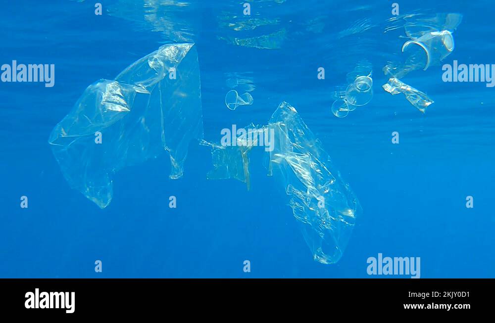 Massive plastic pollution. A lot of plastic debris drifting under ...