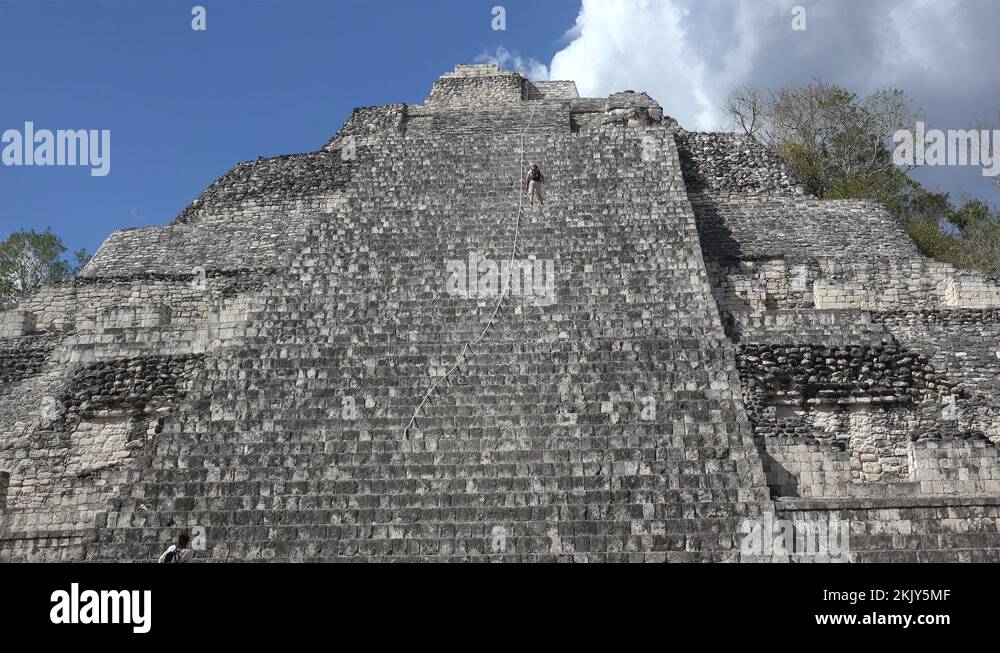 Tourists climbing the Pyramid (Structure IX) at Mayan Ruins in Becan ...