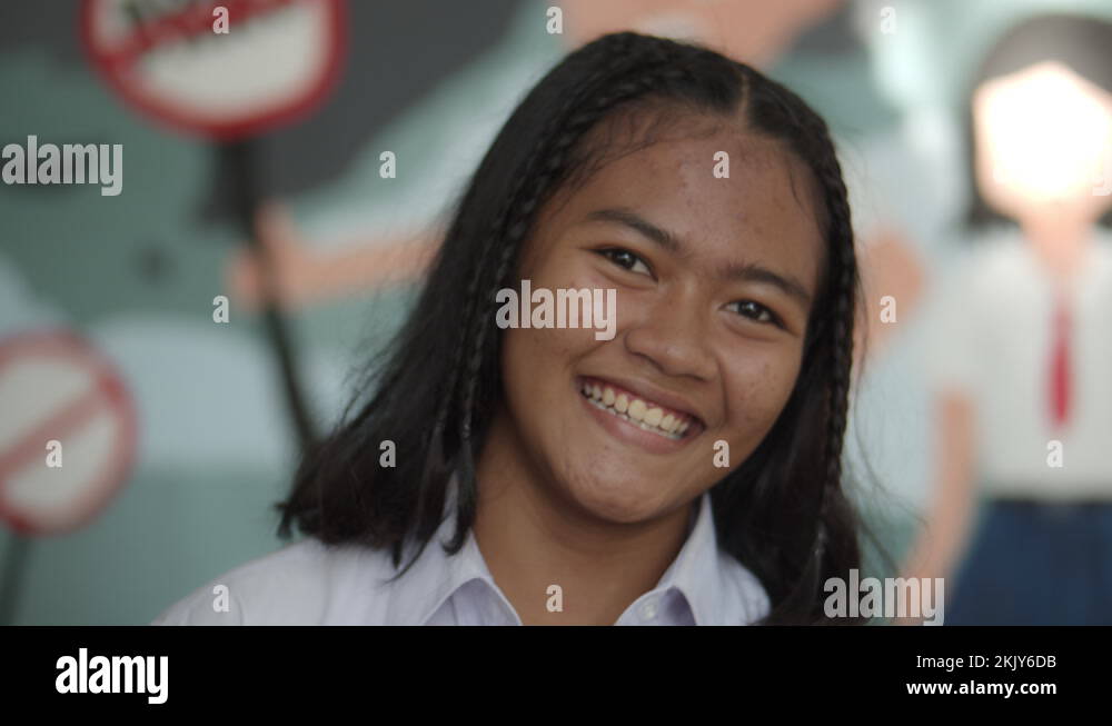 Asian female high school student who is native, smiling and laughing ...