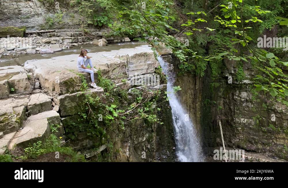 Woman sitting near waterfall Stock Videos & Footage - HD and 4K Video ...