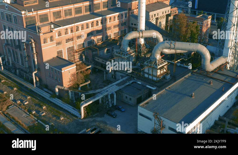 Old factory of the early 20th century with pipeline and chimneys in the ...