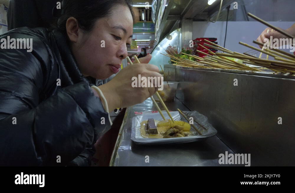 China young chinese woman eating snack Stock Videos & Footage - HD and ...