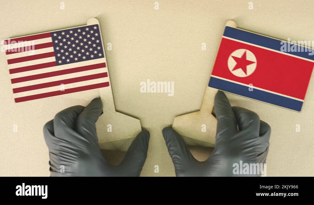 Flags of the USA and North Korea made of cardboard on the desk Stock ...