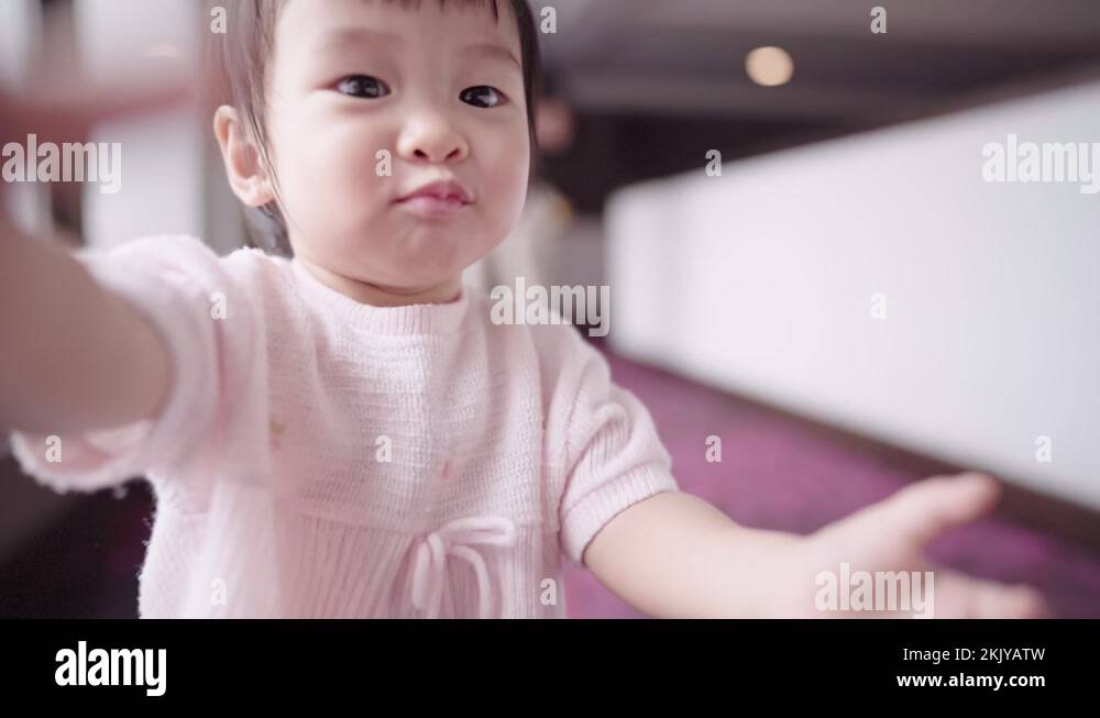 Asian adorable little girl smiling chasing following camera, child ...