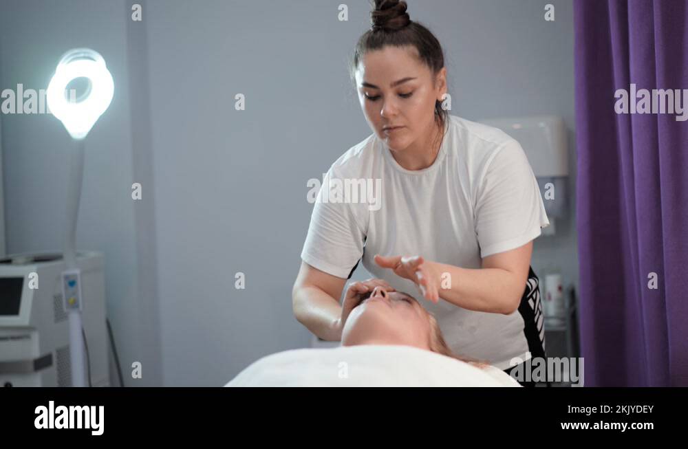 Woman Masseur Make Face Relaxing Massage Beautiful Female Client In