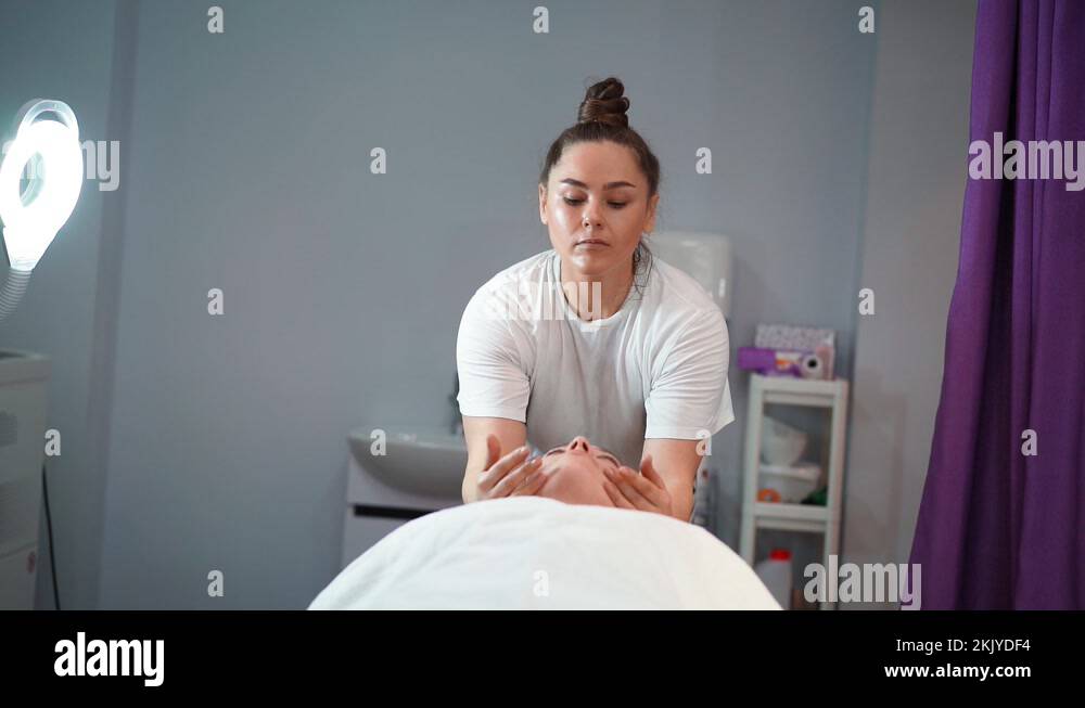 Woman Masseur Make Face Relaxing Massage Beautiful Female Client In