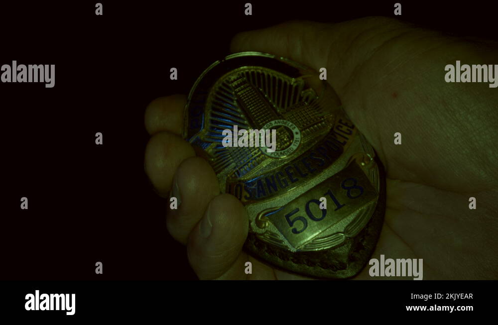 LAPD BADGE IN HAND, NIGHT CRIME SCENE. 4K, ECU Stock Video Footage - Alamy