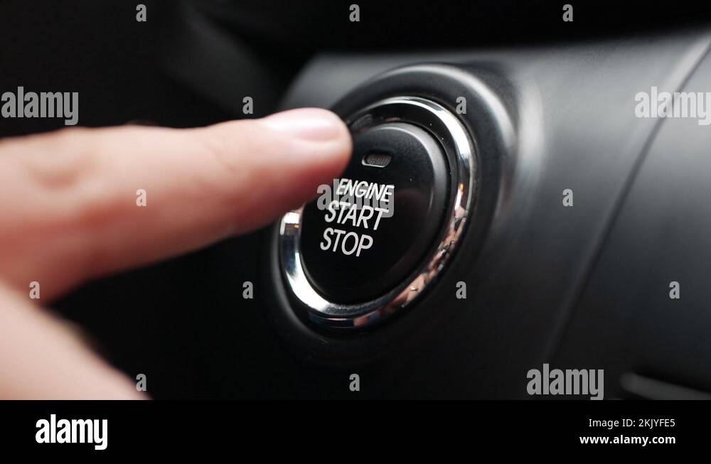 Man is pressing the button engine start in car. Start car engine by ...