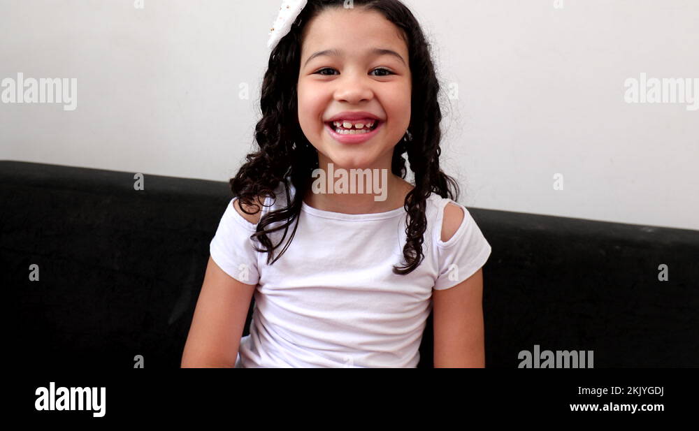 Kid influencer speaking to camera showing like and subscribe signs ...