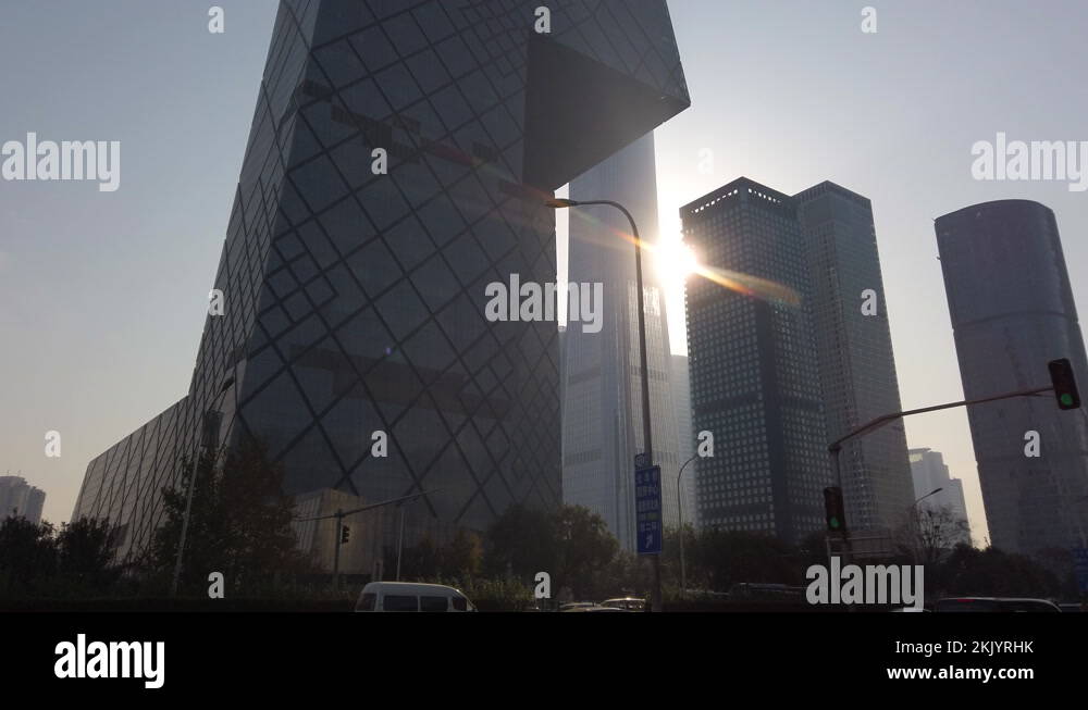 Cars driving on Guomao Business District, with background of CCTV tower,Beijng Stock Video ...