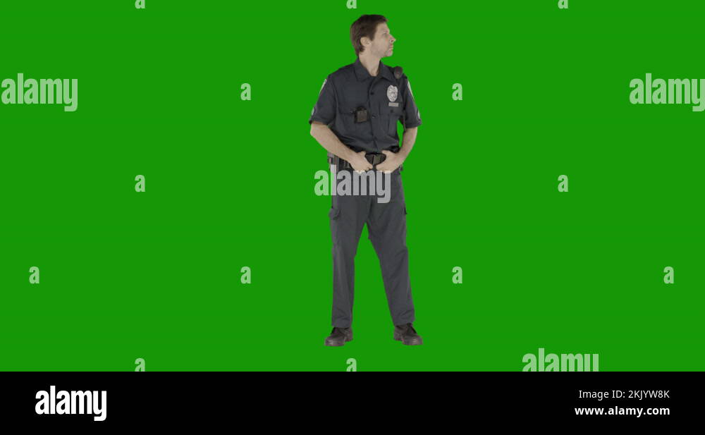 CHROMA KEY Caucasian male police officer standing against green screen ...