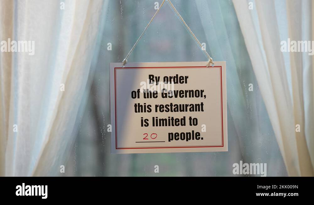 Limited indoor Seating sign hanging in the window of store front ...