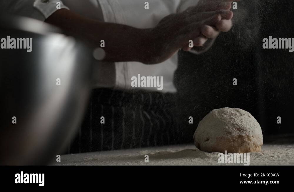 bakery chef clapping flour making bread dough. Baking concept Stock ...