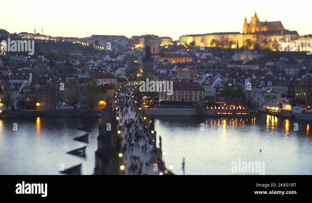 people silhouettes wander along illuminated Charles Bridge Stock Video ...