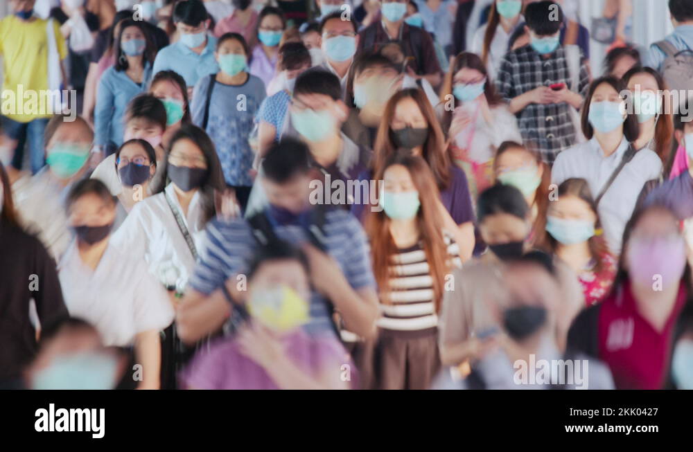 Time-lapse of crowded Asian people wear face mask, walk in pedestrian ...
