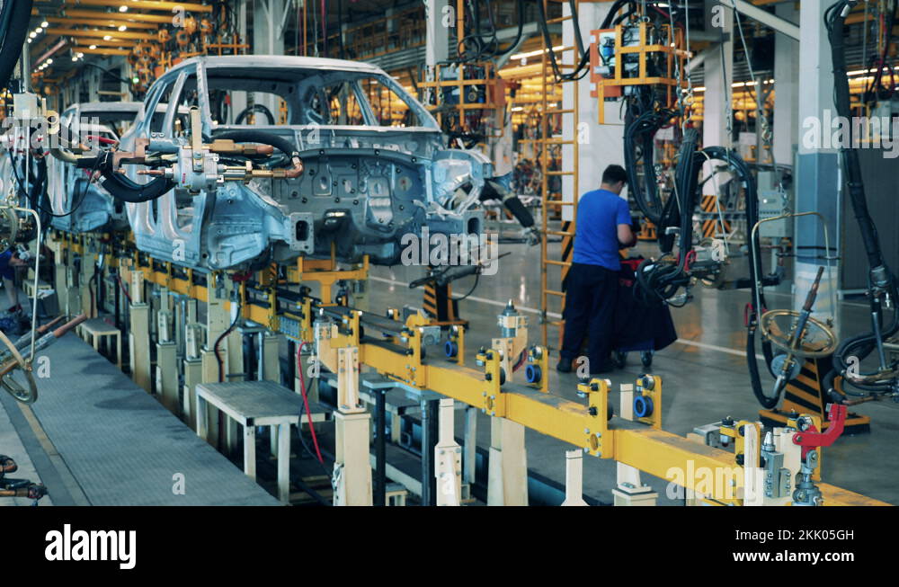 Modern vehicle body production line at a car manufacturing facility ...