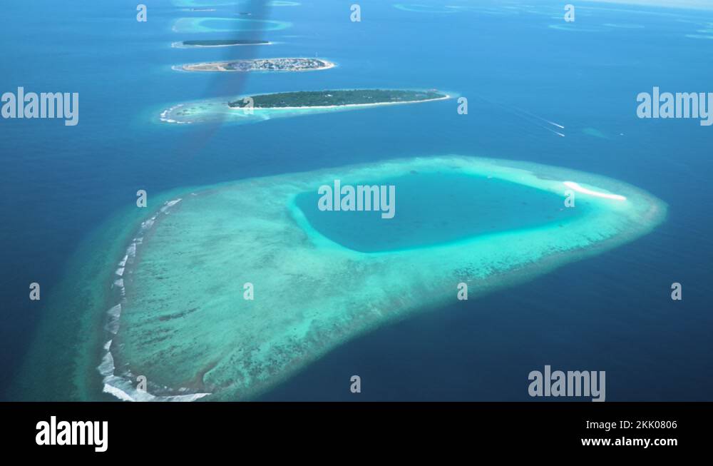 Huge line of atolls, natural coral reefs, popular tourist destination ...