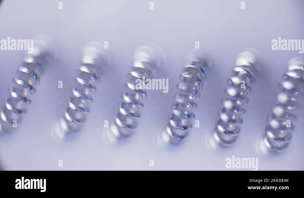 Double spiral filament in a lamp. 100x magnification under a microscope ...