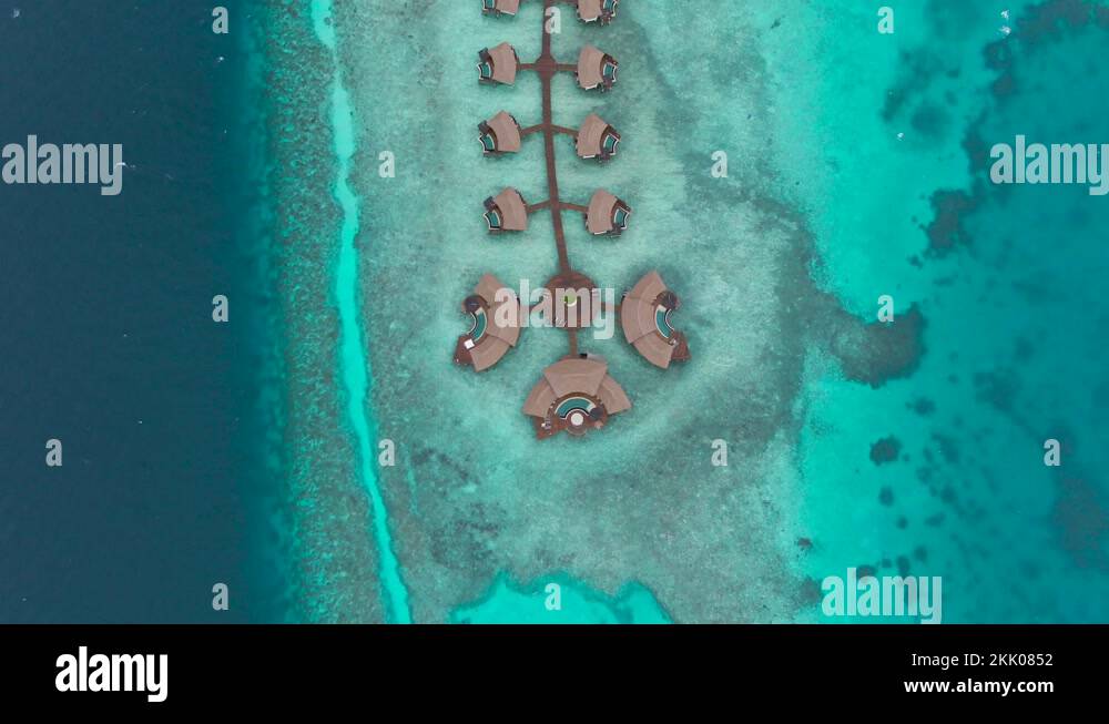 Human impact on shallow atolls coral reefs in The Maldives with hotel ...