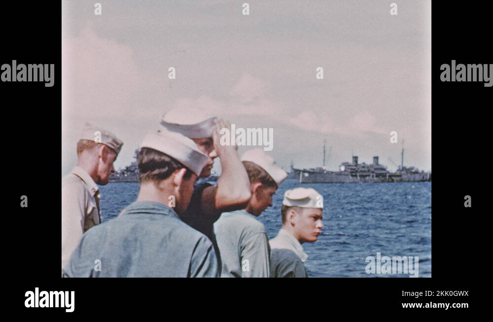 1940s Bikini Atoll: Ship, port, sailors form line, walk down steps ...