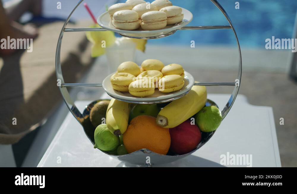 girl sunbathing by the pool. lying down while sunbathing and taking ...