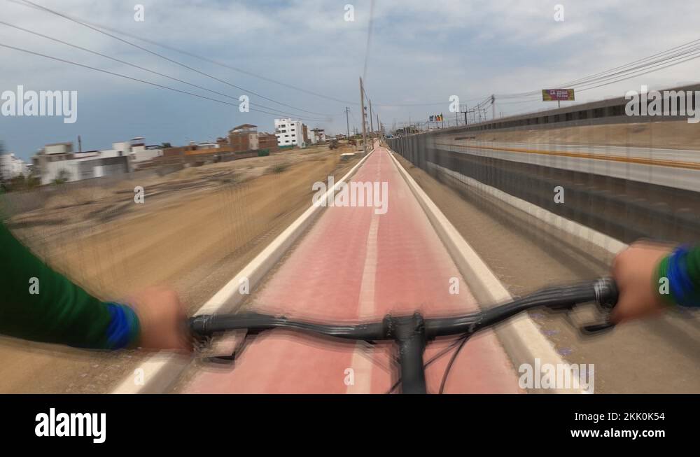 point of view in fast camera riding a bicycle through the cycle path ...