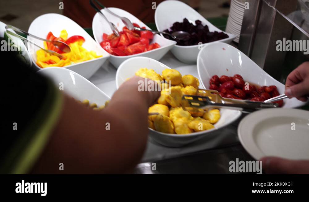 breakfast, buffet in hotel. people put food on their plates Stock Video ...