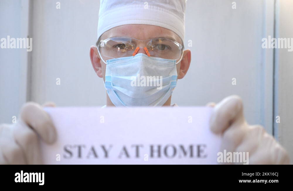 Medic shows poster with an appeal to self-isolation. Safety life from ...