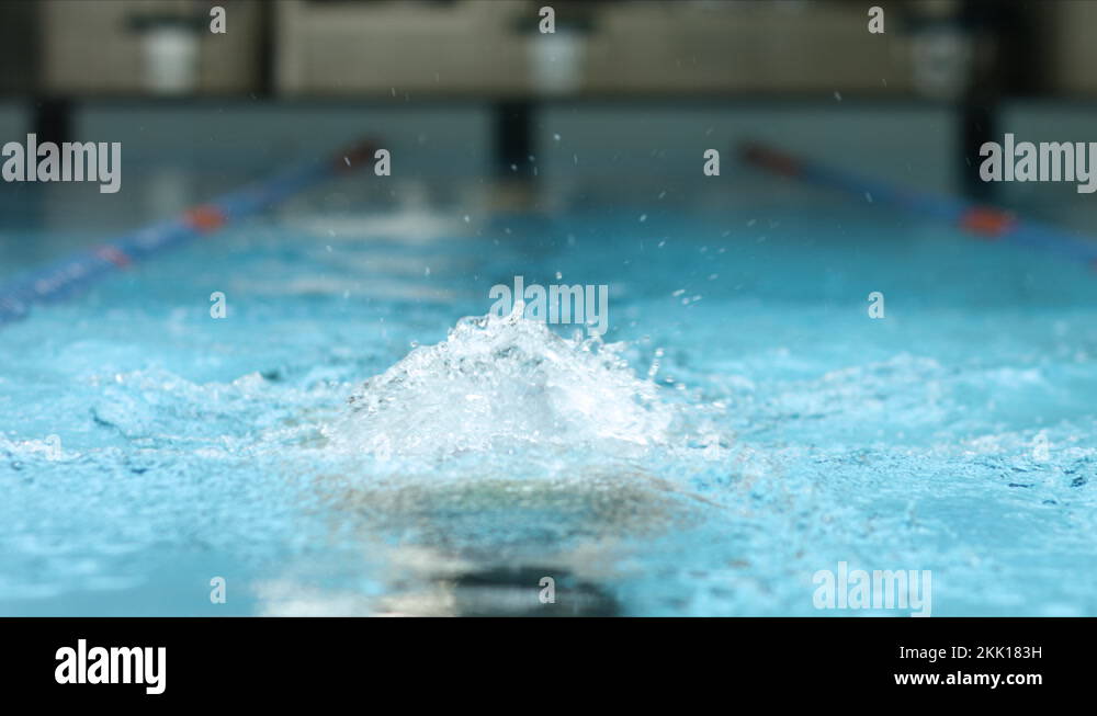 Woman swimmer taking deep breaths and swimming fast-slow motion shot ...