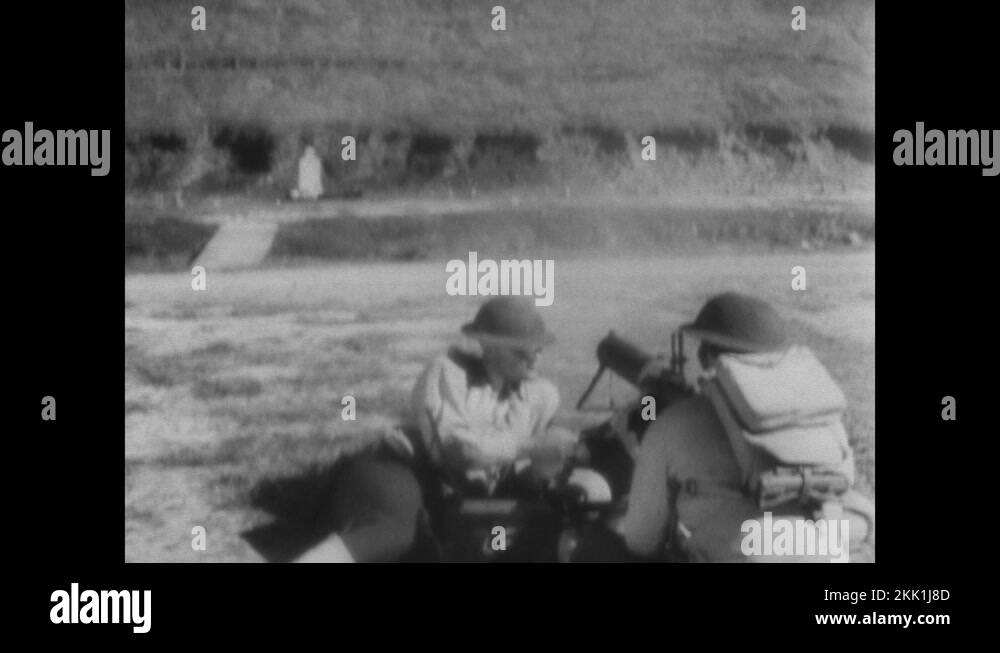 1940s: loading machine gun and shooting down range, planes rolling down ...