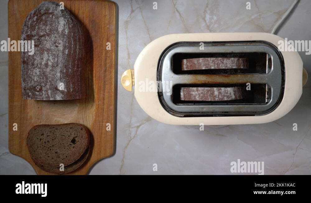 Male hand take toasts out from toaster top down view Stock Video ...