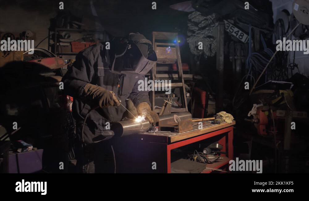 Man fabricating stainless steel pipe shielded metal arc welding in Stock Video Footage - Alamy