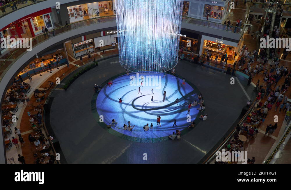 famous singapore mall crowded main hall decoration slow motion top view ...