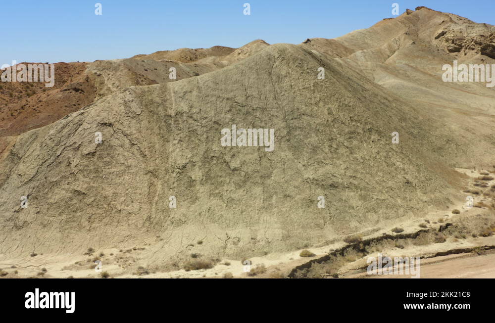 Rotating view around a section of dry sandy mountains in the Rainbow ...