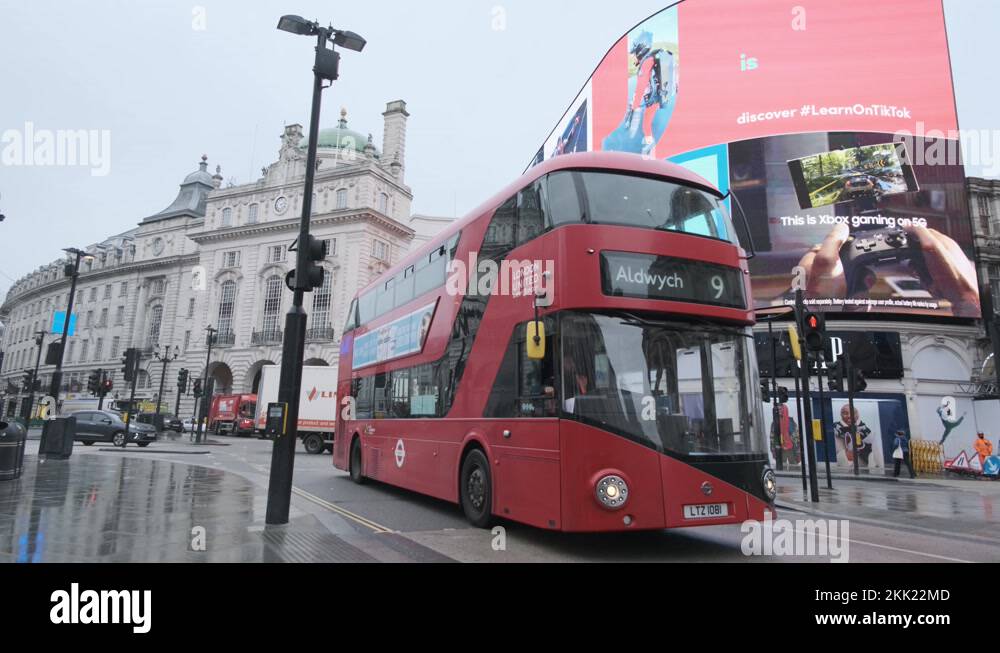 Iconic London bus passing in front of Piccadilly circus London Stock ...