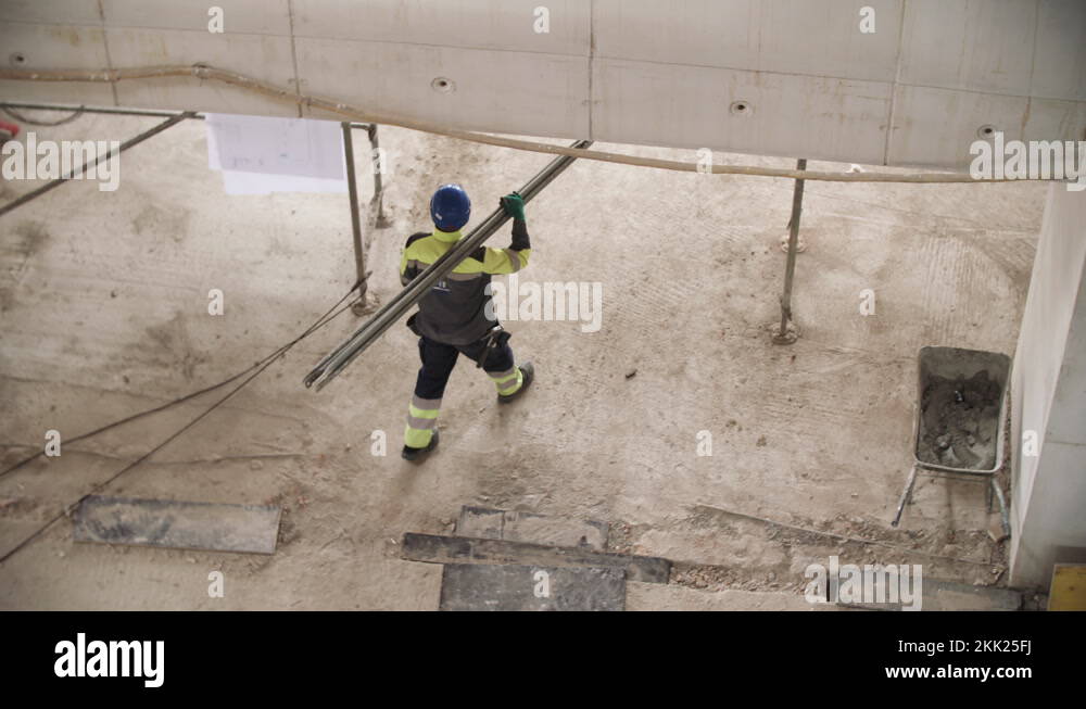 Worker carrying pipe Stock Videos & Footage - HD and 4K Video Clips - Alamy