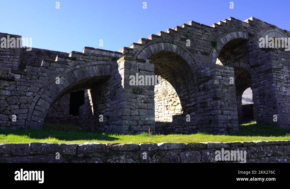Stone stairs on arched thick walls of medieval castle remaining from ...