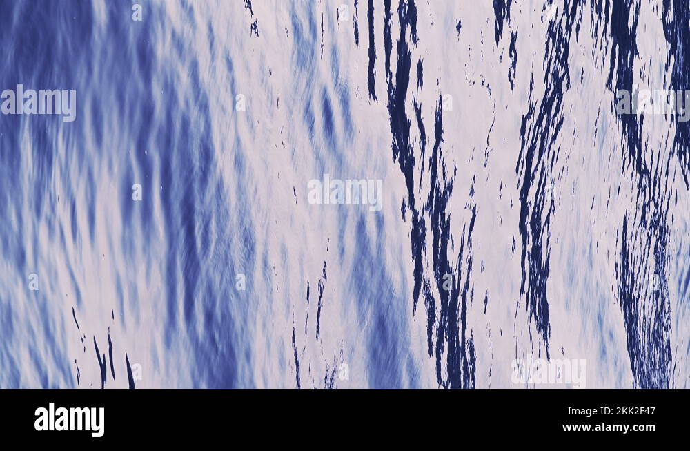 Vertical background video of flowing water, a nature abstract with ...