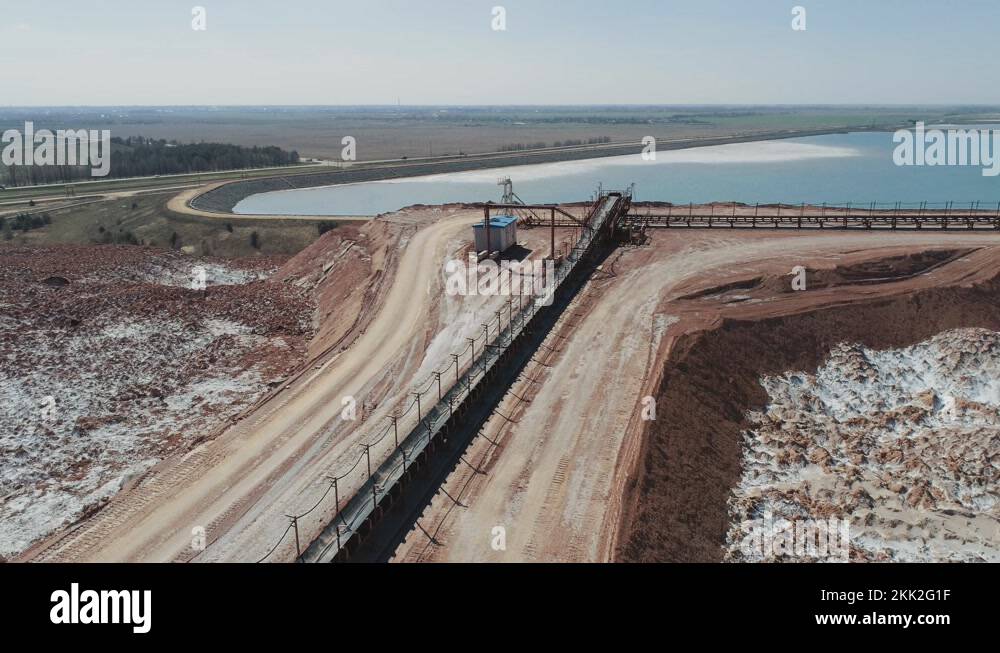 Mining of potash salt, conveyor line in salt pits, aerial view of salt ...