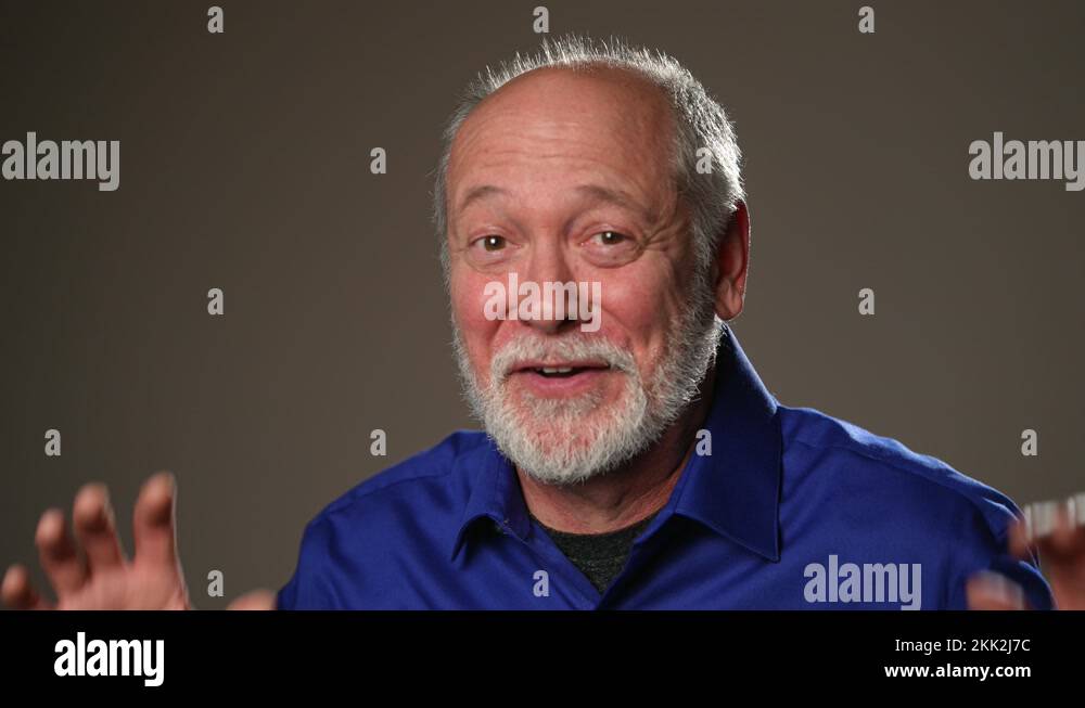 Portrait of happy male boss with beard looking at camera with huge WOW ...