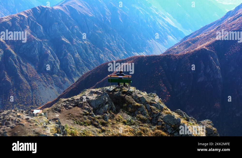 Bench on edge of the abyss. Man on the edge of the abyss Stock Video ...
