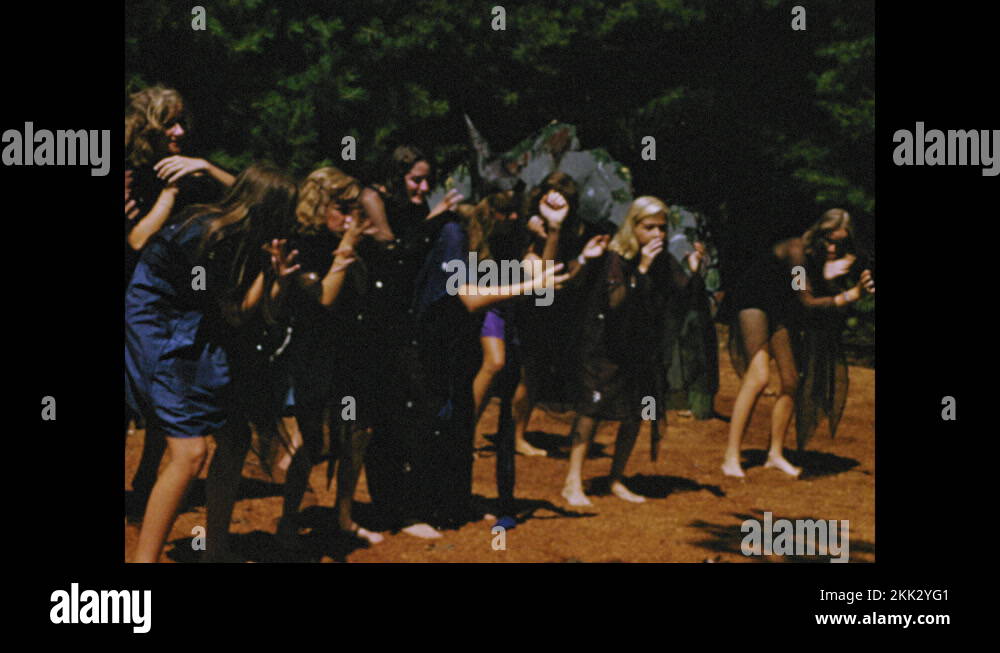1940s: Girls dressed up in fairy tale costumes perform outdoor play ...