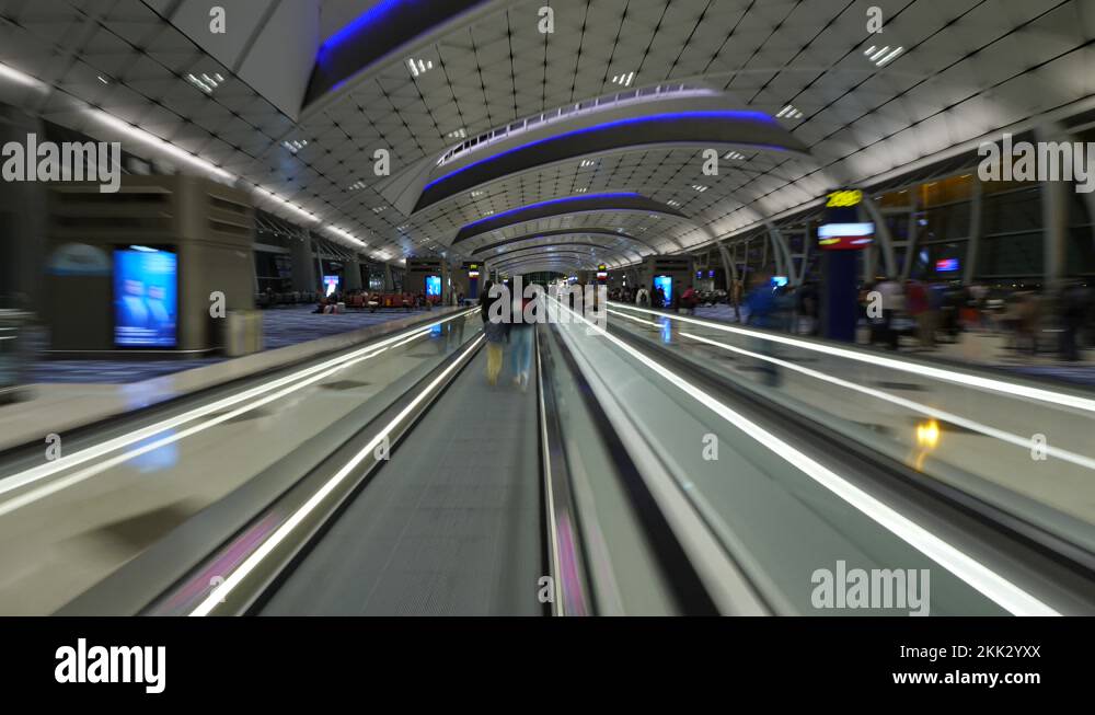 Walk from center of airport concourse, along boarding gates, hyperlapse ...
