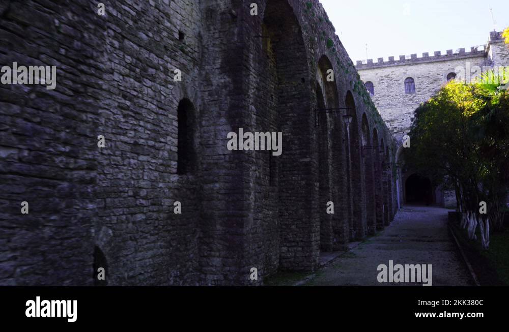 High walls with arched gates of Medieval Castle of Argjiro in stone ...
